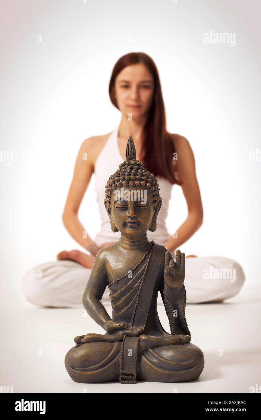 Buddha statue with woman, symetrical Stock Photo - Alamy