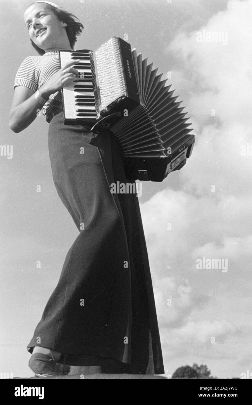 Woman playing harmonica Black and White Stock Photos & Images - Alamy
