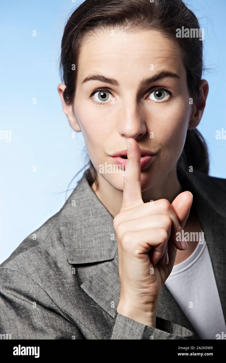 Woman symbolizing silence Stock Photo - Alamy