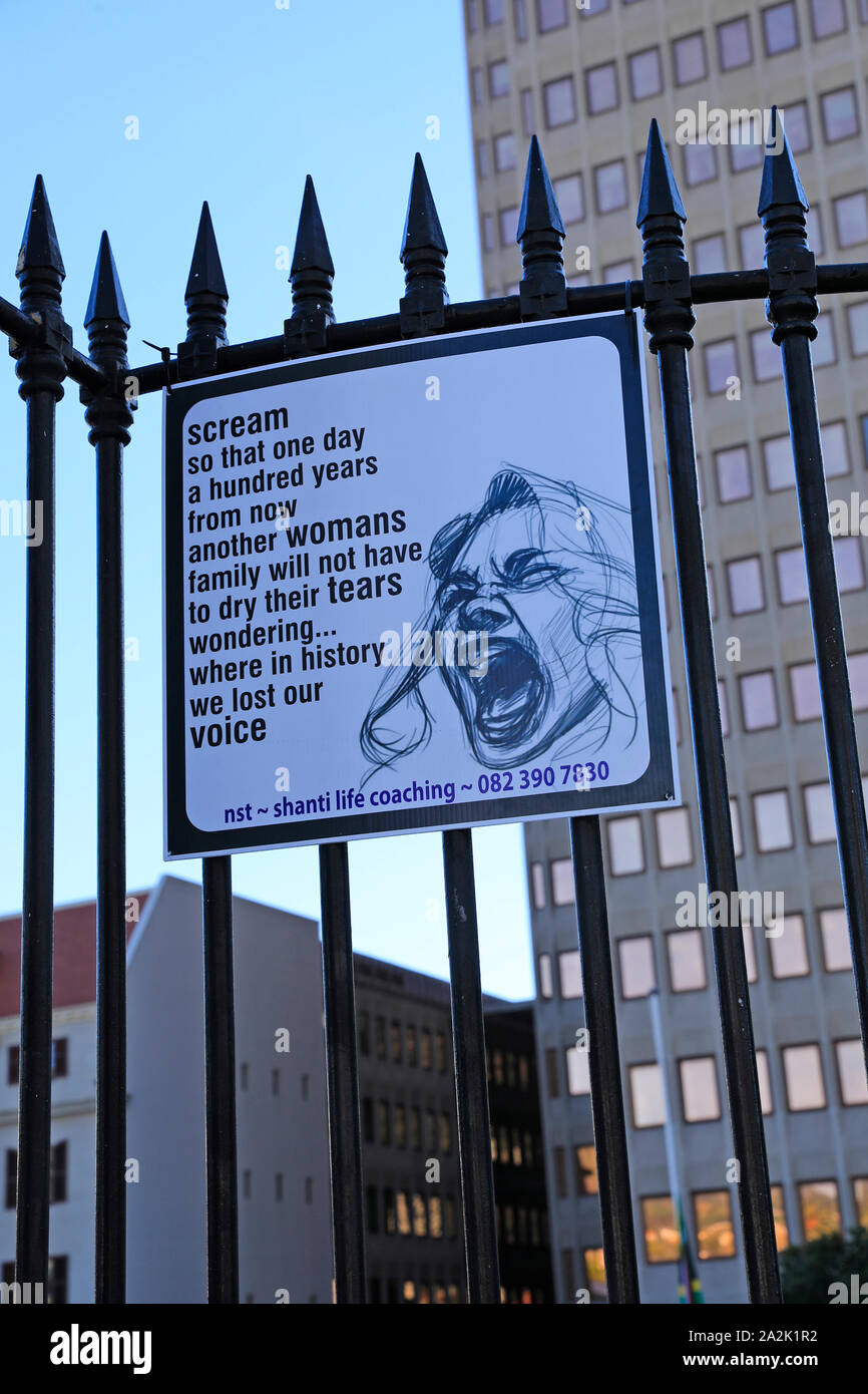 Left over signs from a women's march against gender-based violence and ...