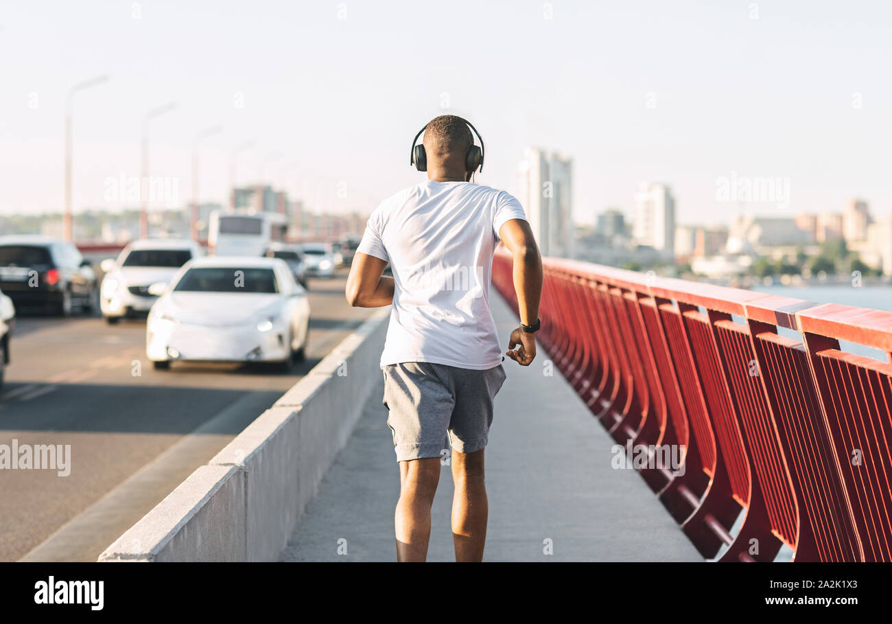 Male running along road hi-res stock photography and images - Alamy