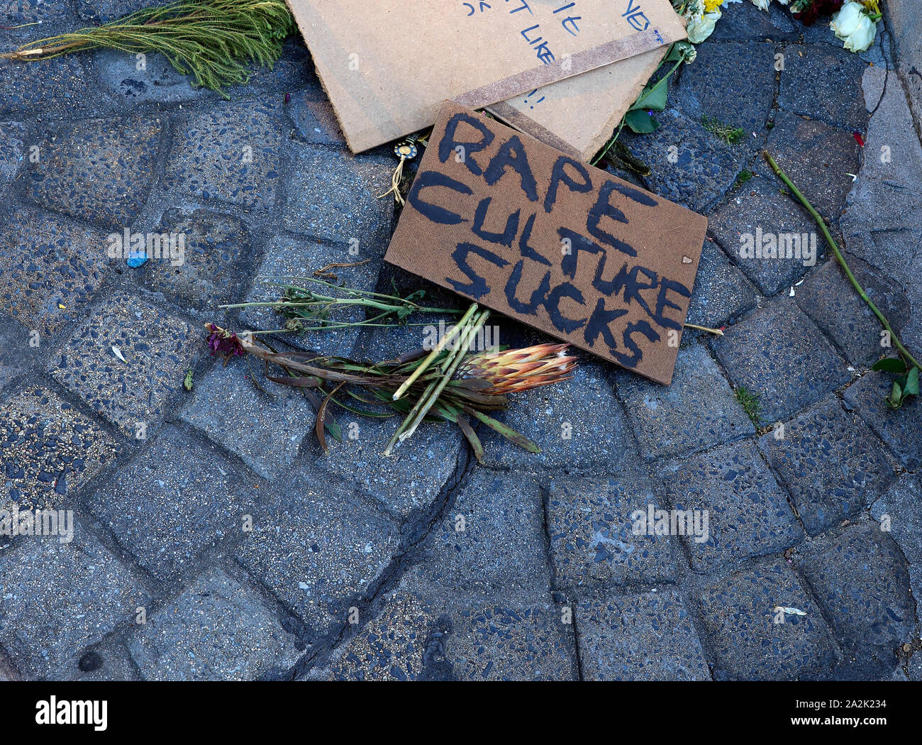 Left over signs from a women's march against gender-based violence and ...