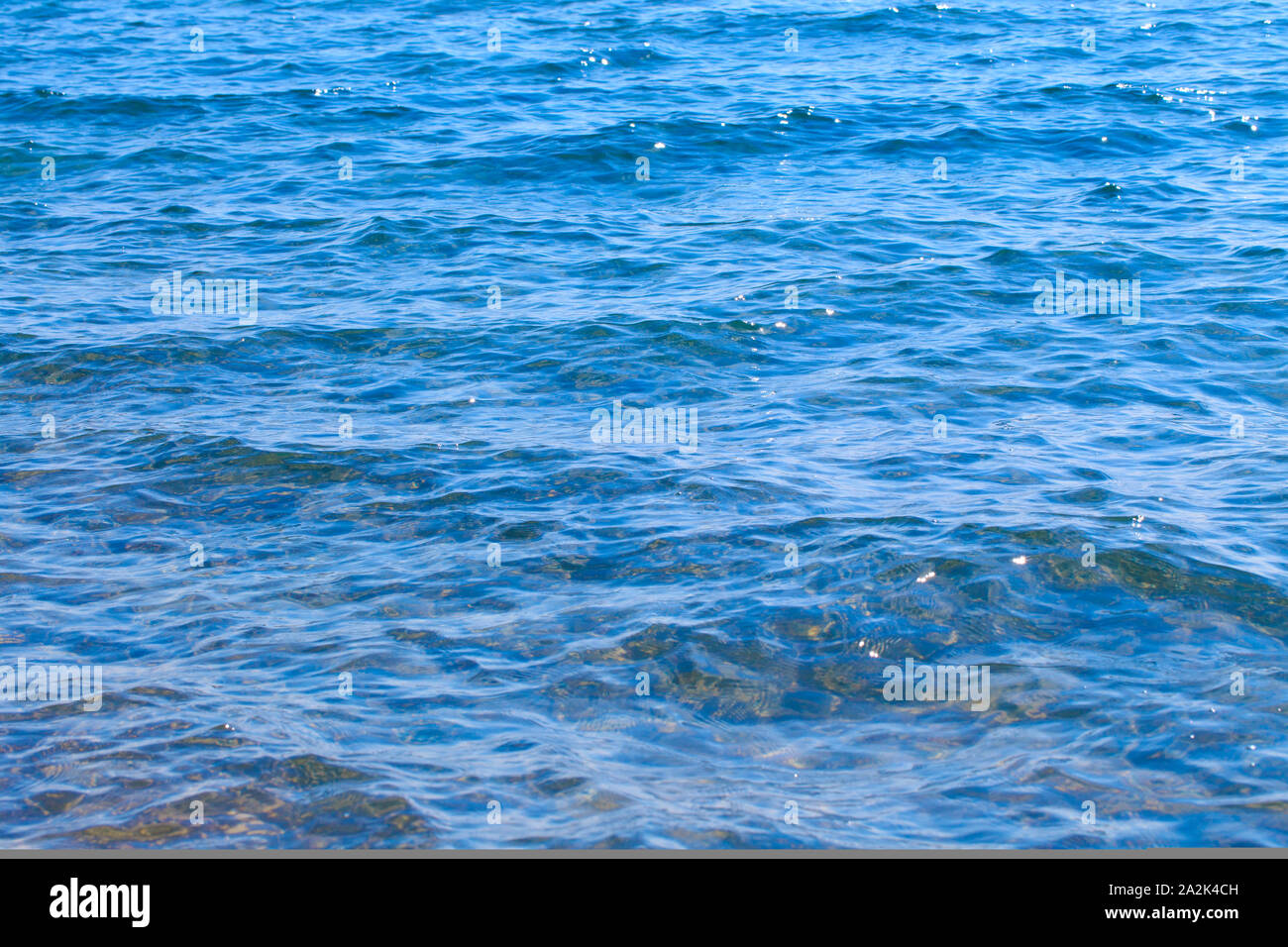 Clear water texture in blue and orange. Background of the ocean and the ...