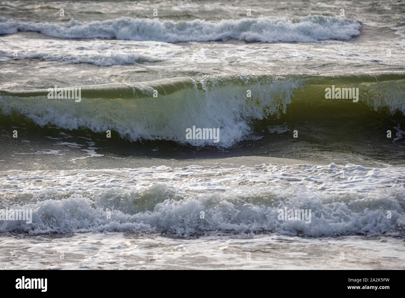 Breaking waves in the sea. Dangerous ocean waves with foam crashing ...