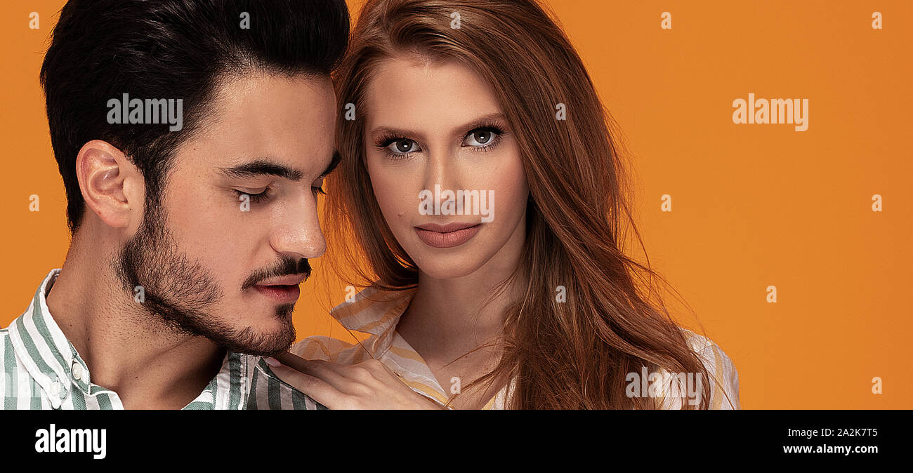 Young couple hug studio hi-res stock photography and images - Alamy