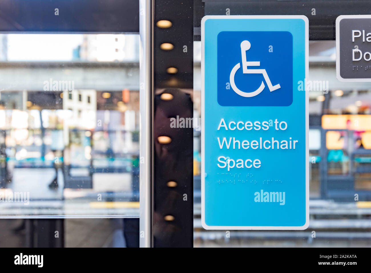 A sign with a wheelchair symbol at a train wheelchair access point on ...