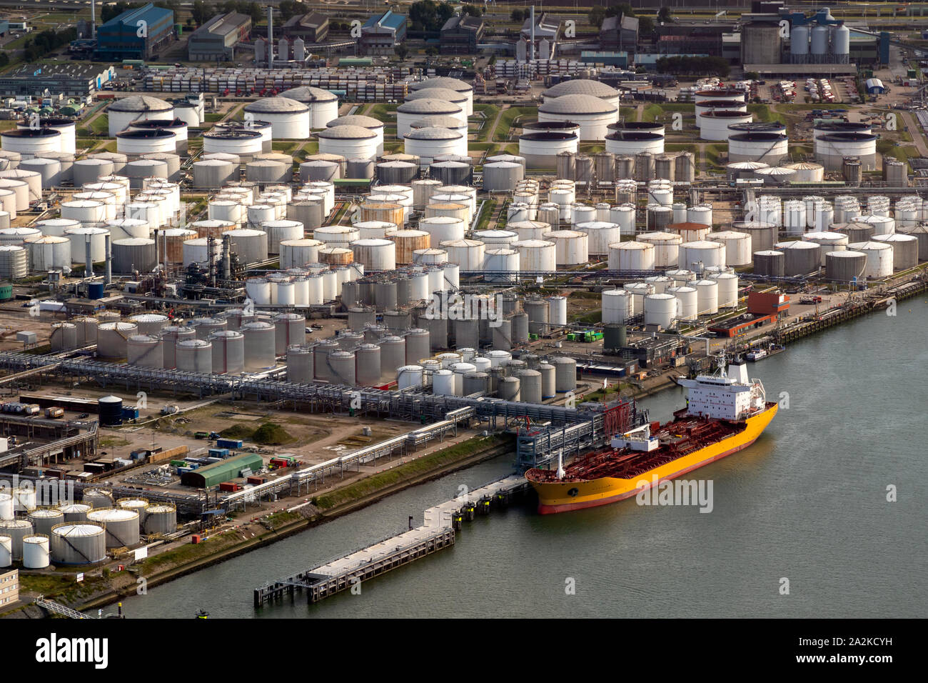 Aerial view of an oil tanker moored at an oil storage silo terminal ...