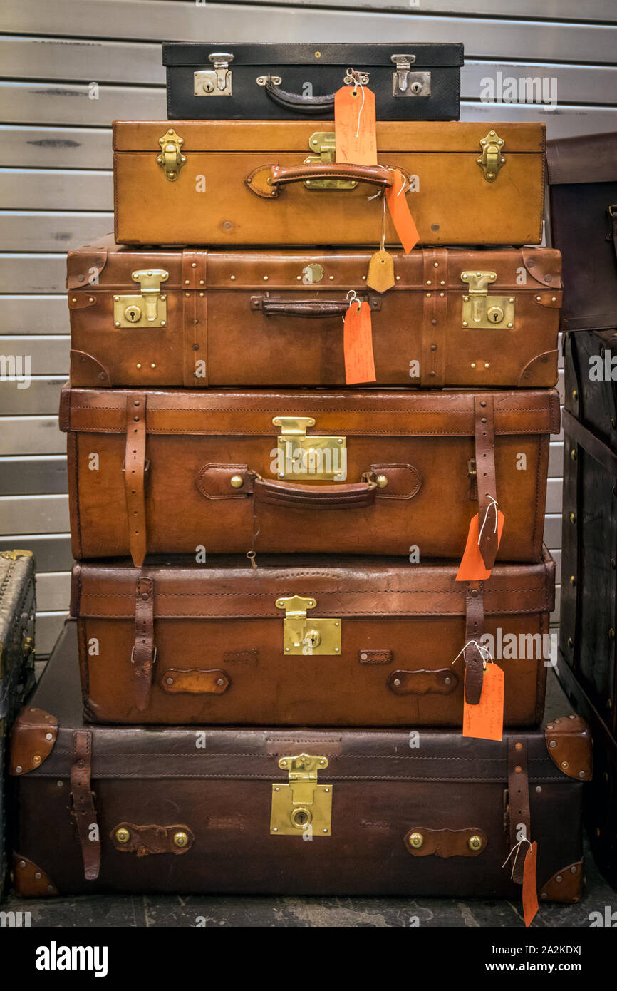 Stacked vintage leather suitcases Stock Photo - Alamy