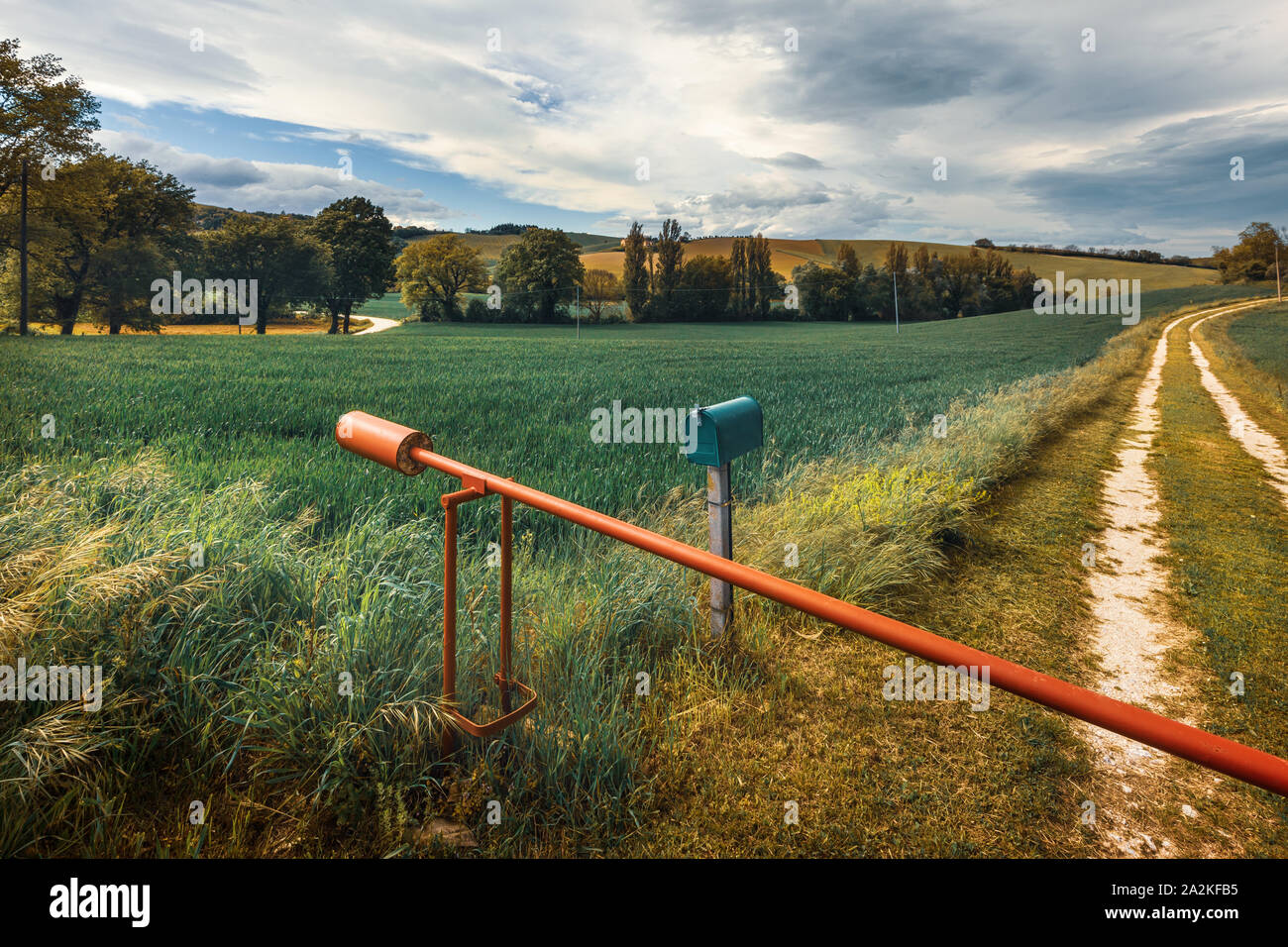 Beautiful rural landscape on spring, gate of farm Stock Photo - Alamy