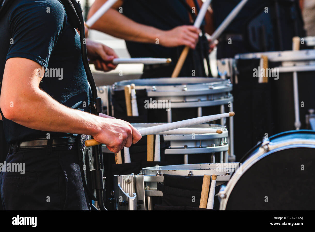 a portion of the marching band drum line performing Stock Photo - Alamy