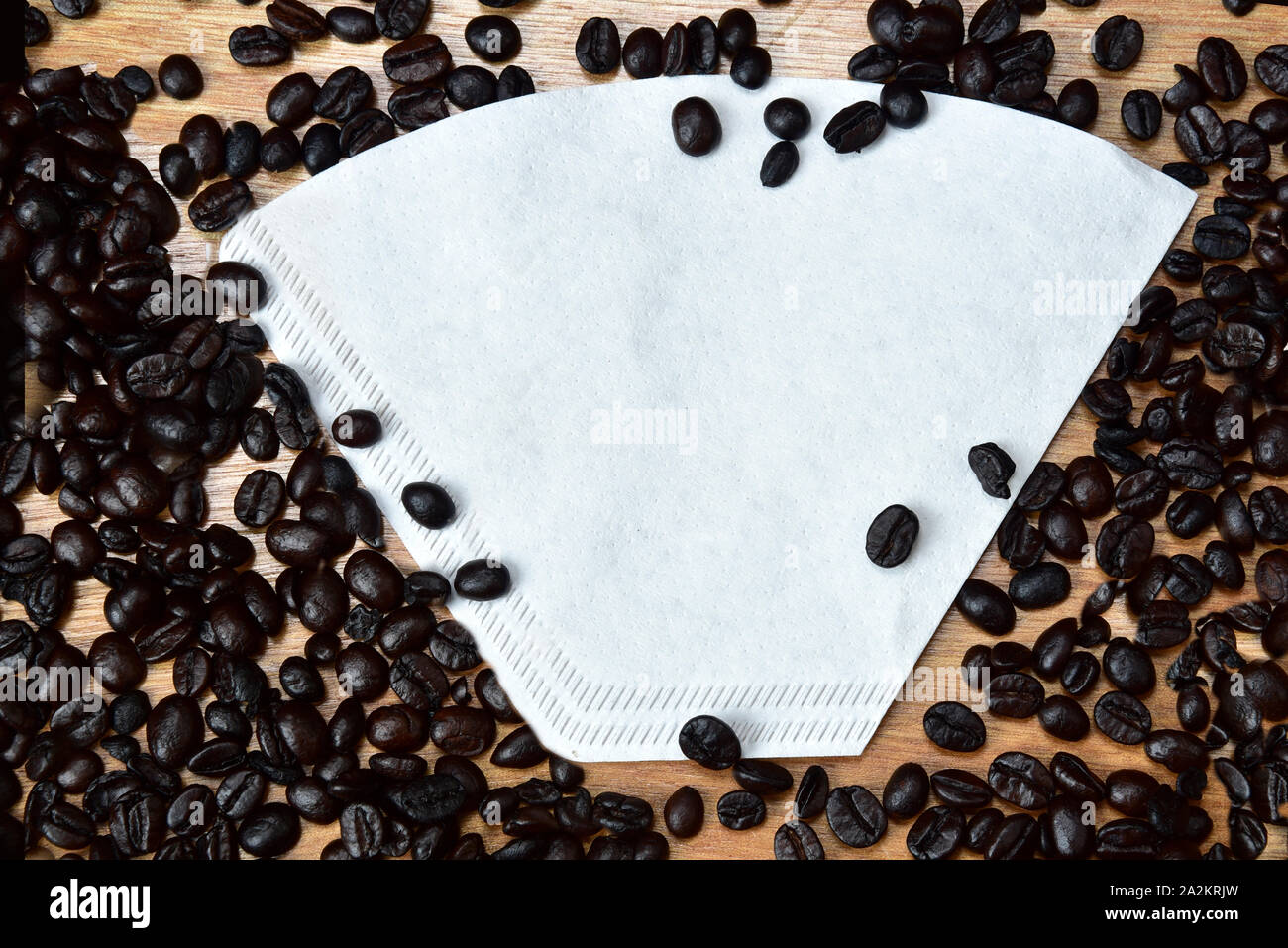 roasted coffee bean and paper colander Stock Photo - Alamy