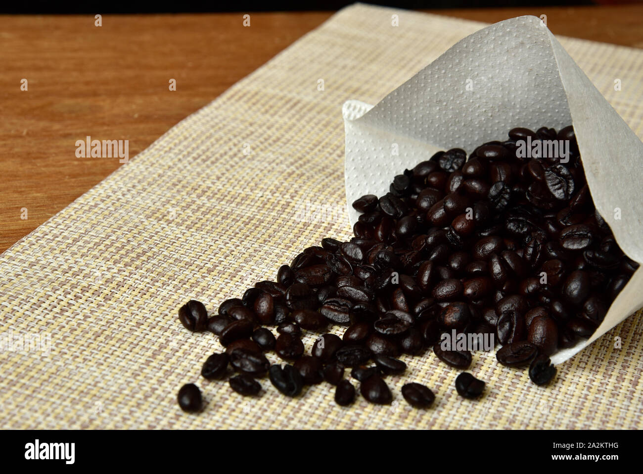 roasted coffee bean and paper colander Stock Photo - Alamy