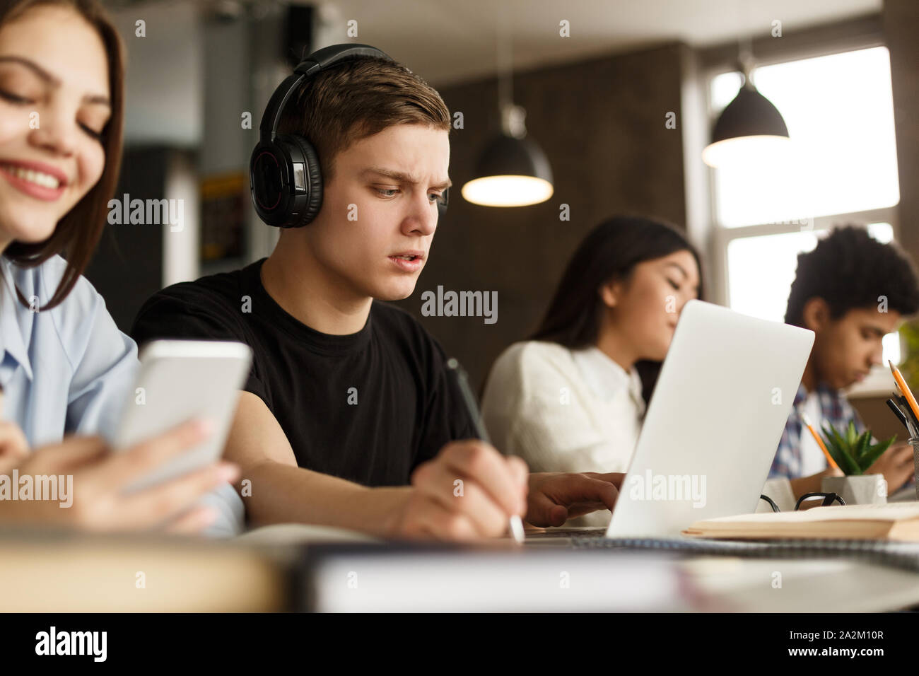 Group students headphones indoors hi-res stock photography and images ...