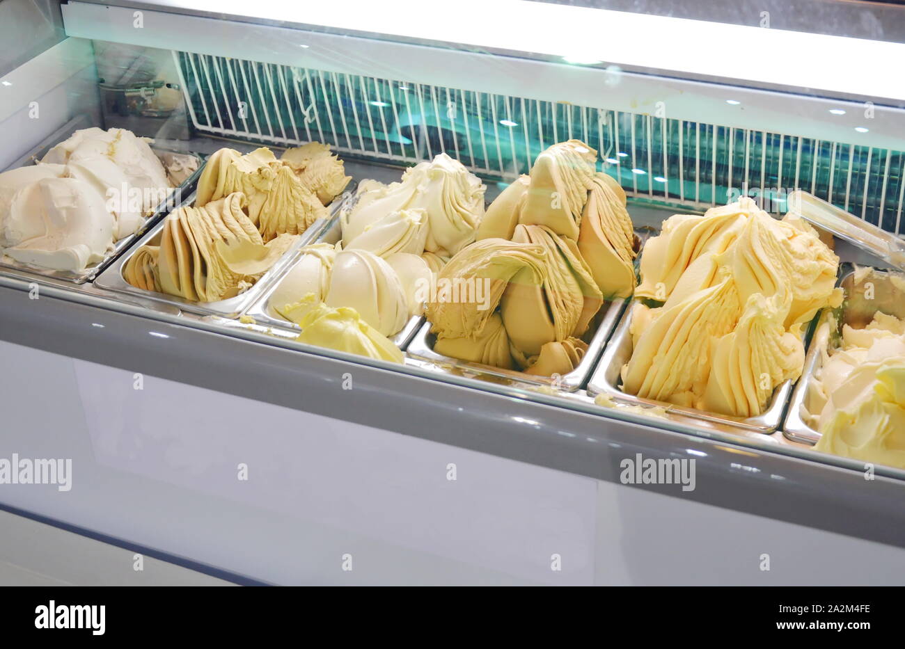 Gelato Italian ice cream mixed cream and fruits on box in electric ...