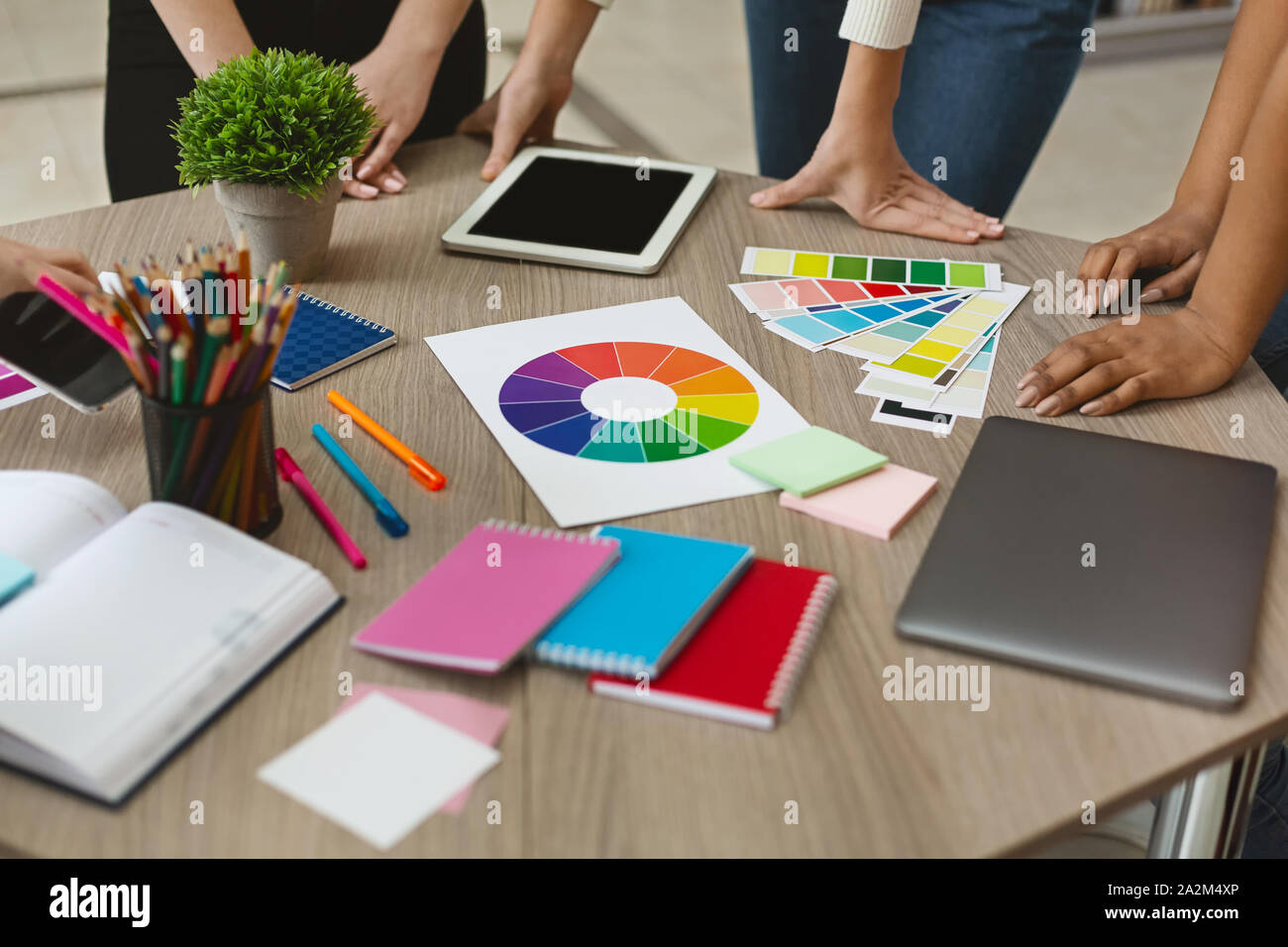 Group of graphic designers checking on color swatch samples Stock Photo ...