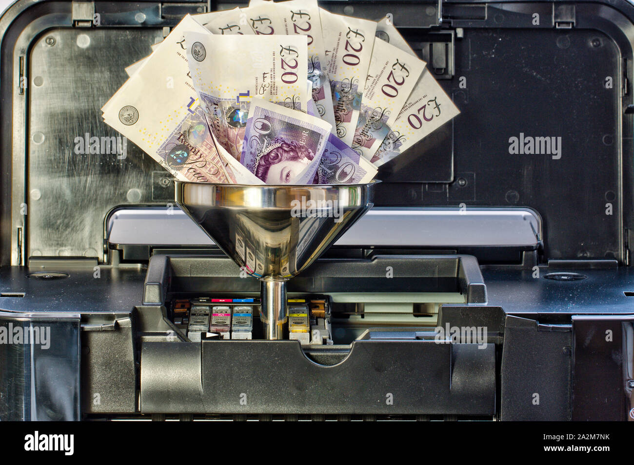 Consumer home inkjet printer with funnel stuffed full with £20 notes to ...