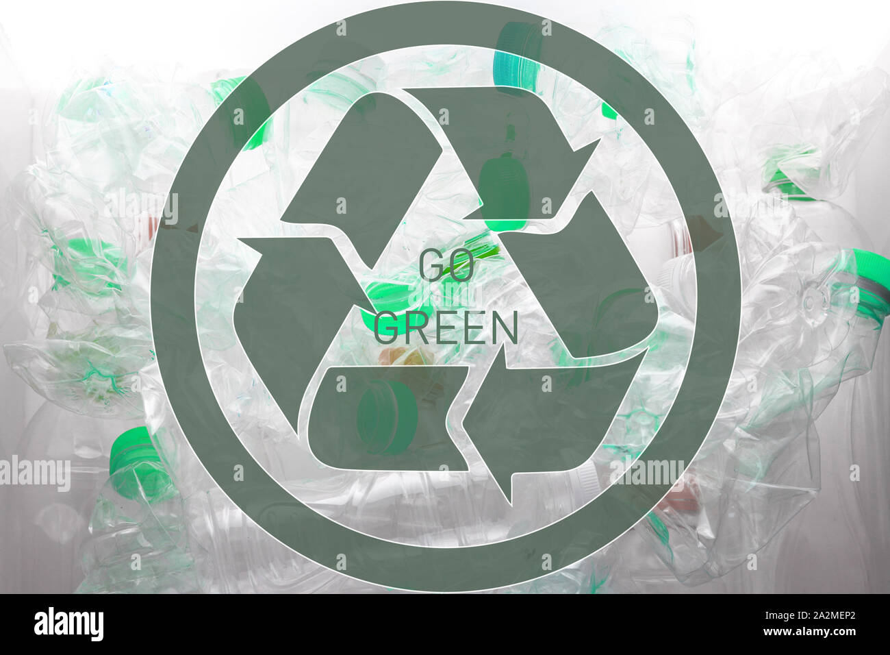 a big recycle symbol and go green word lay on many crushed plastic ...