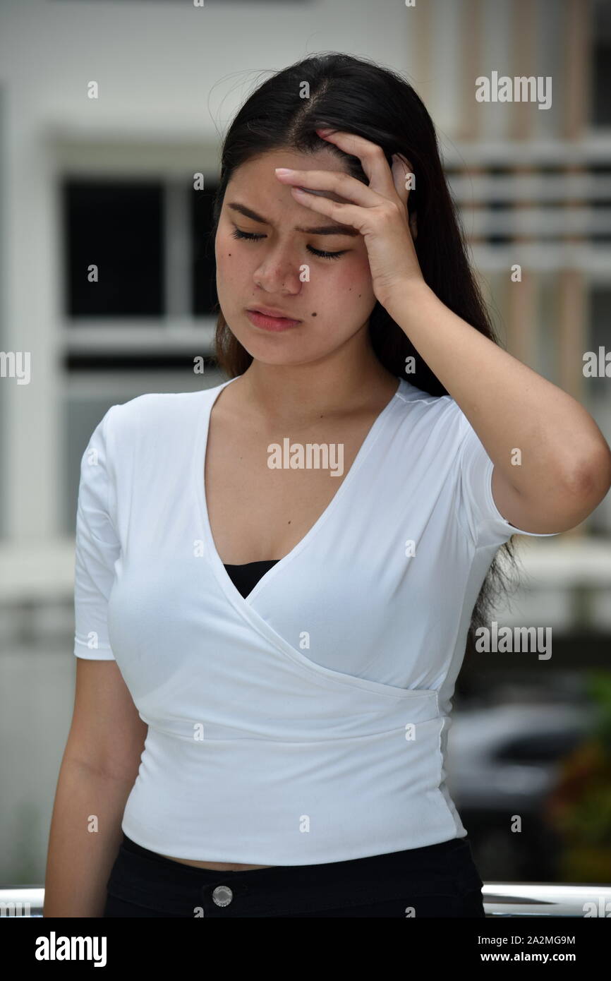 A Worried Beautiful Asian Person Stock Photo - Alamy
