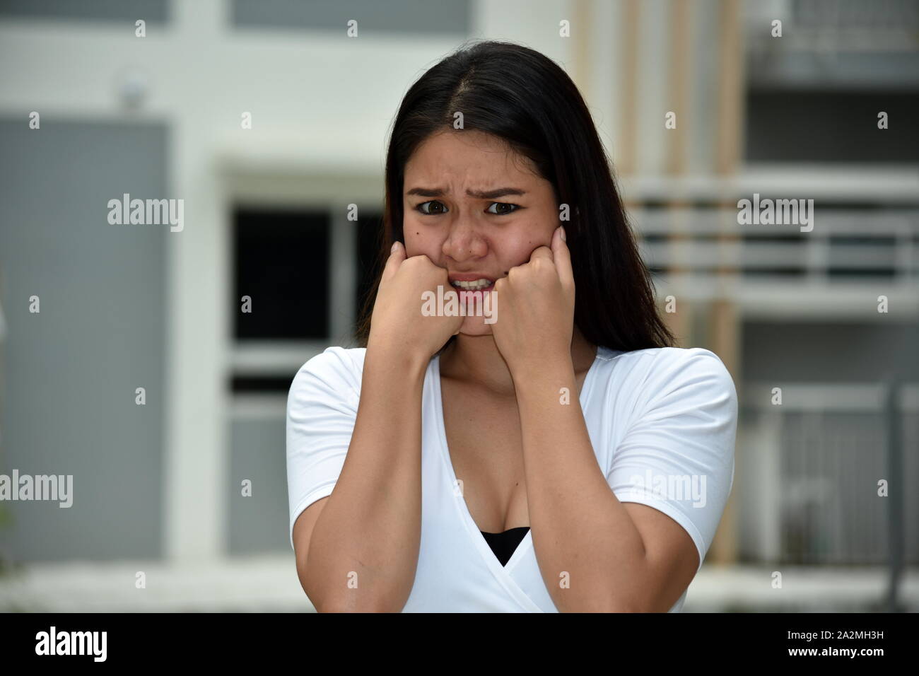 A Youthful Diverse Adult Female Afraid Stock Photo - Alamy