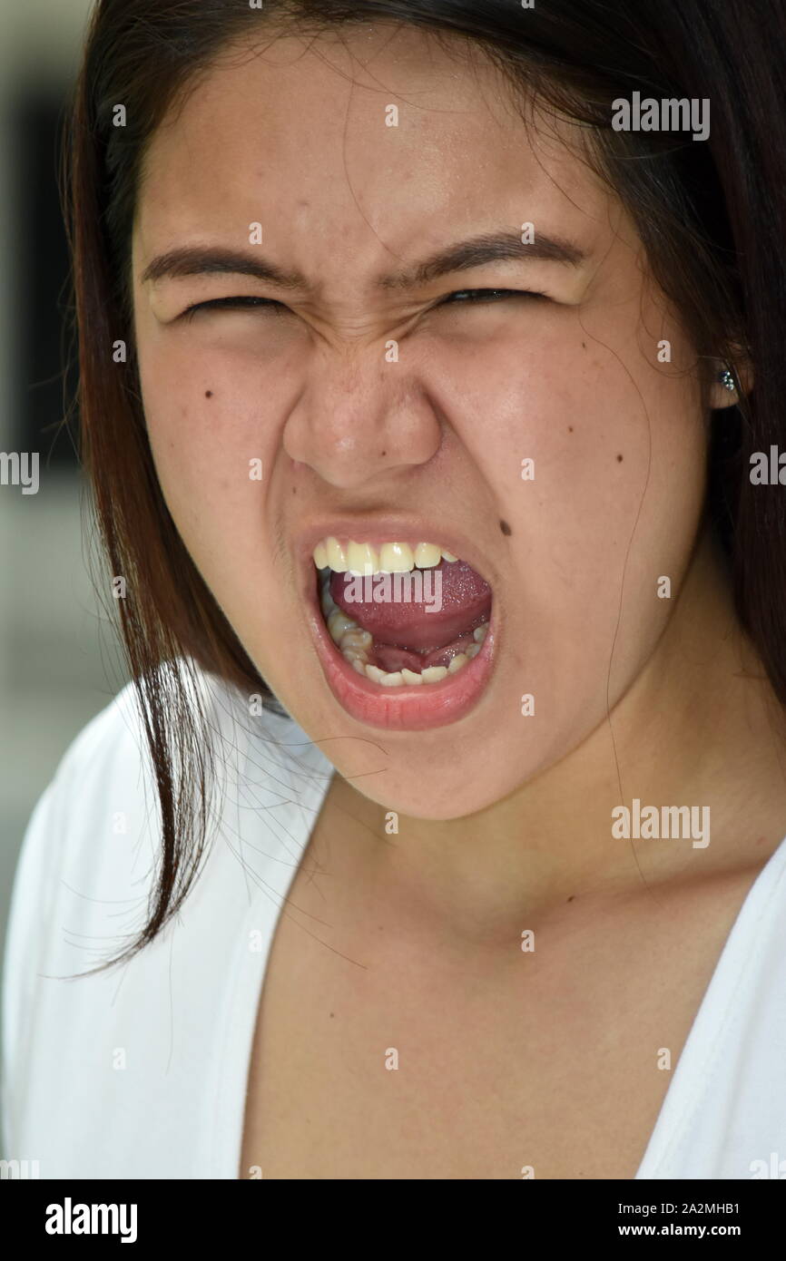 A Stressed Attractive Asian Person Stock Photo - Alamy