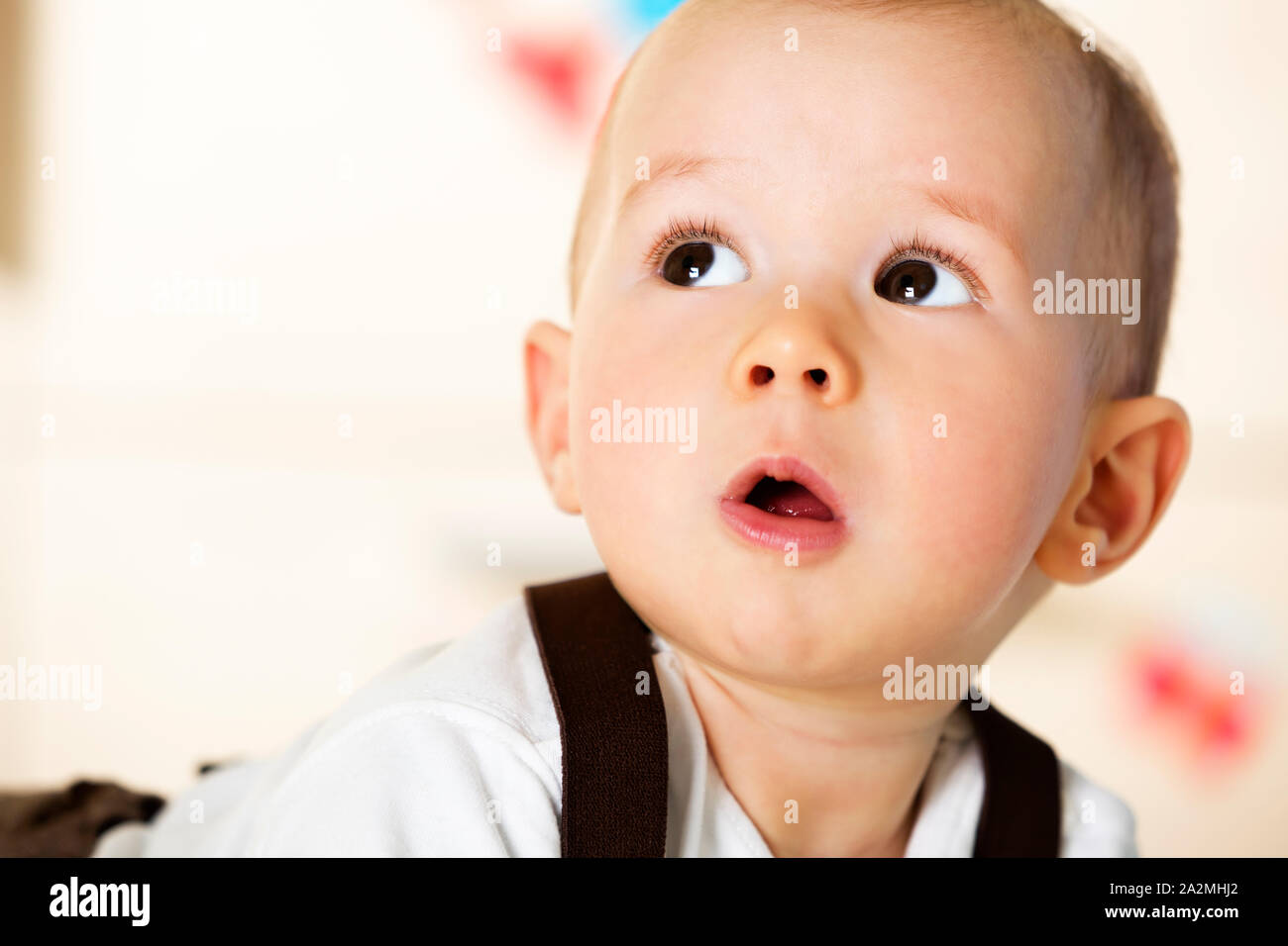 Little boy looking innocently Stock Photo - Alamy