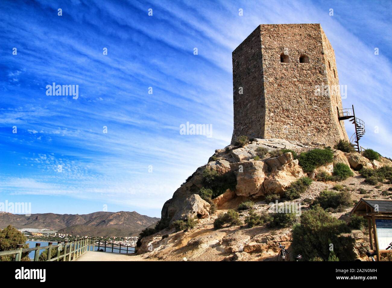 Strong stone Santa Elena tower in the mountain of La Azohia village in ...