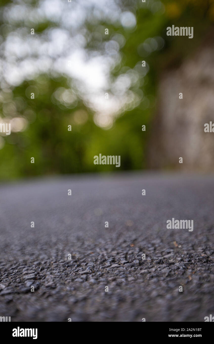 Road from the ground level with bokeh background Stock Photo - Alamy