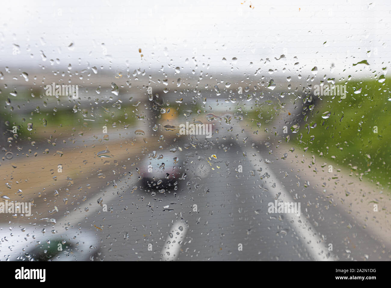 Rain drop on the car glass background Stock Photo - Alamy