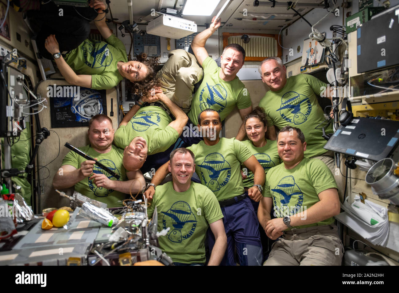 The nine International Space Station crew members pose for a group ...