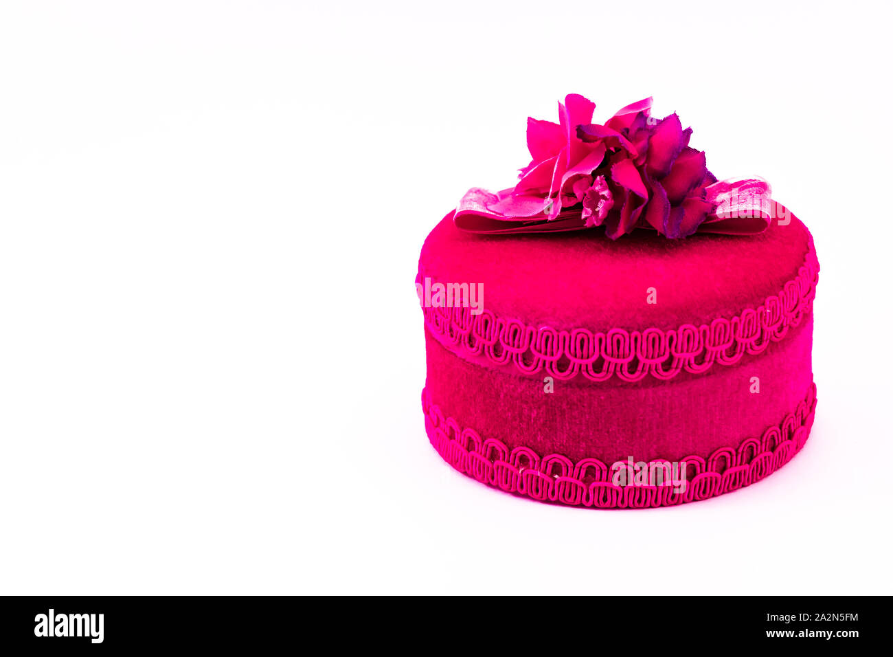Close view of pink gift box decorated with ribbon isolated on white ...