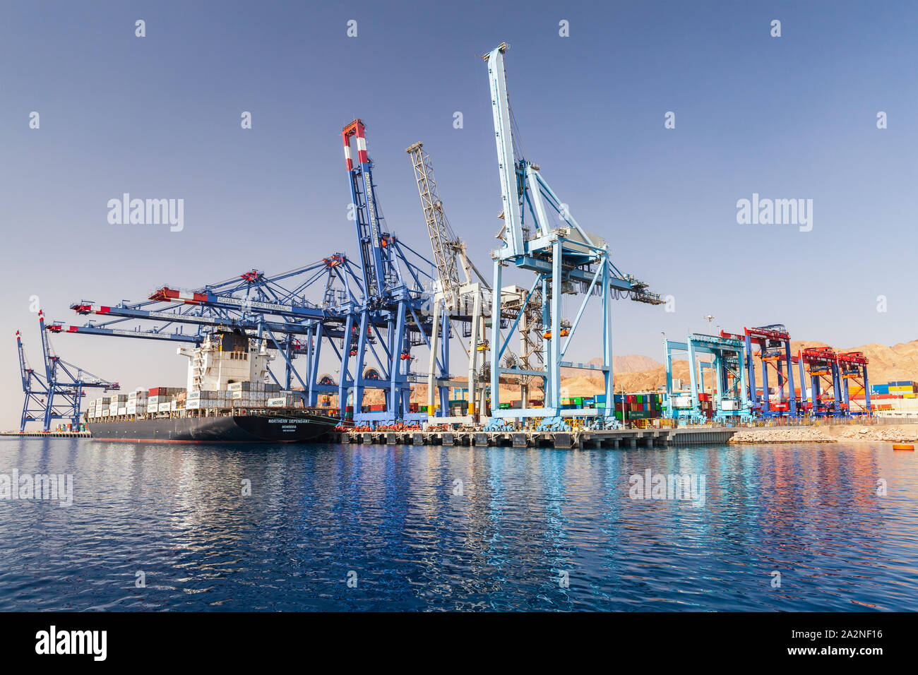 Aqaba, Jordan - May 17, 2018: Unloading huge container ship with gantry ...
