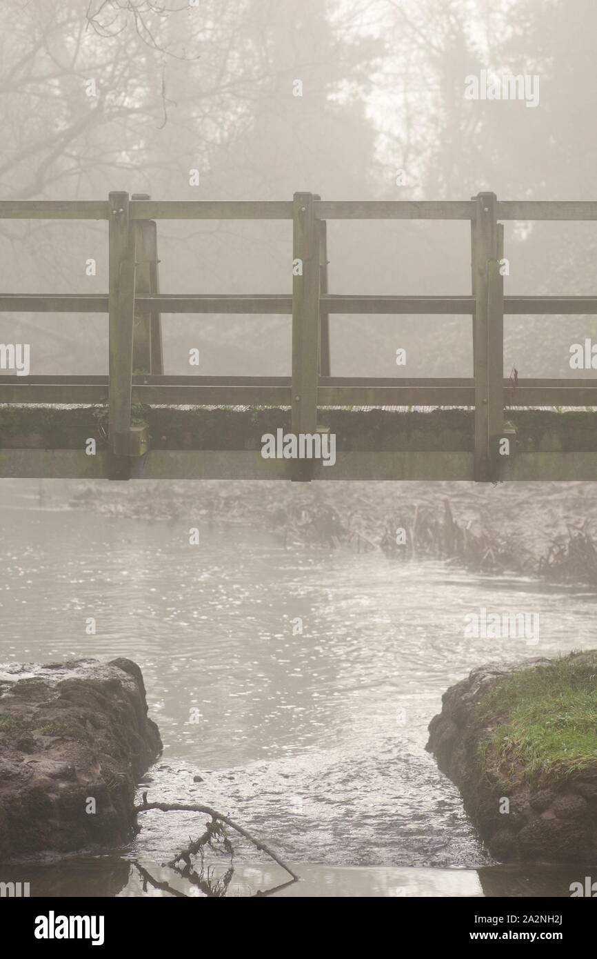Wooden Mill Pedestrian Leat Bridge on a Misty Winters Day. Exeter ...