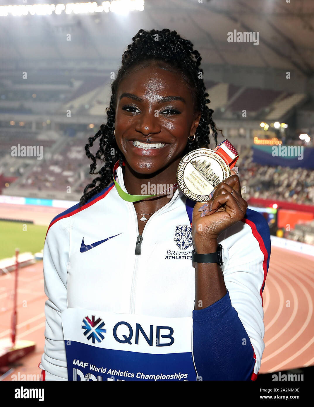 Great Britain's Dina Asher-Smith receives her gold medal for the Women ...
