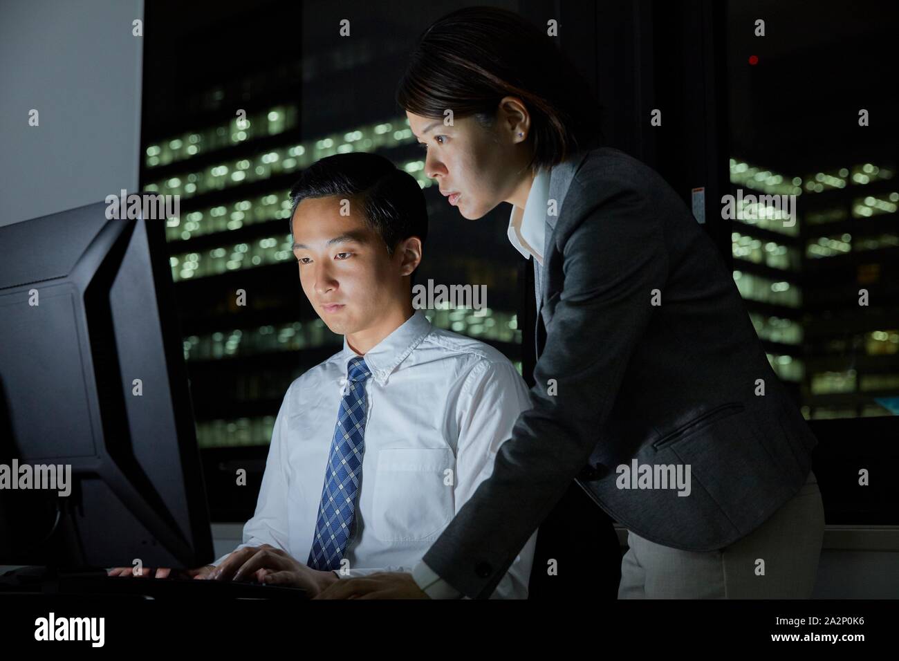 Japanese business people working late at night Stock Photo - Alamy