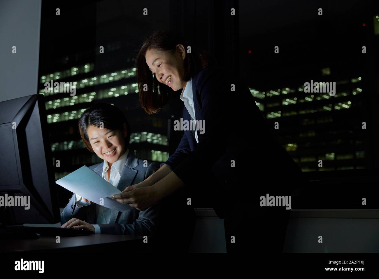 Japanese business people working late at night Stock Photo - Alamy