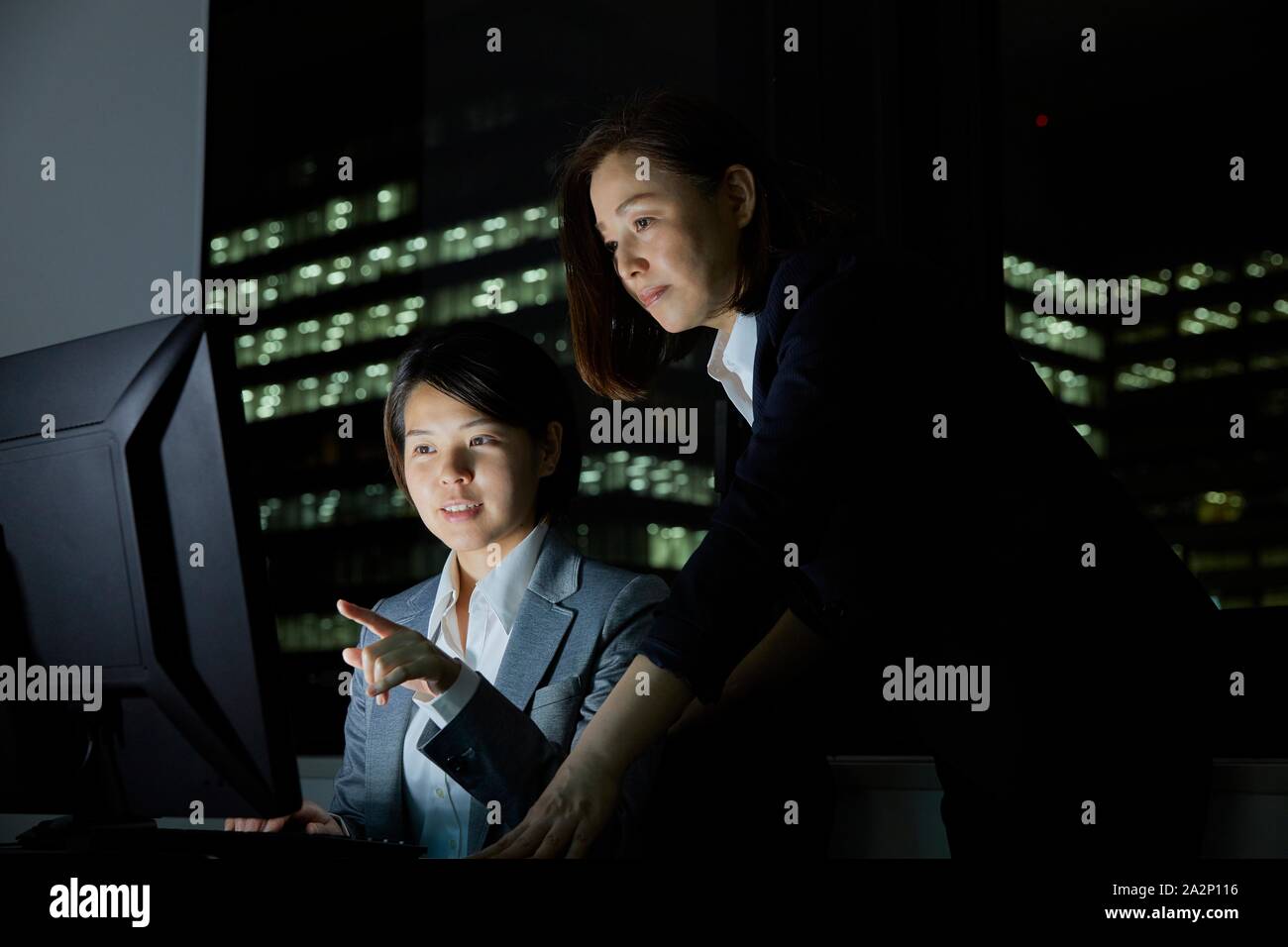 Japanese business people working late at night Stock Photo - Alamy