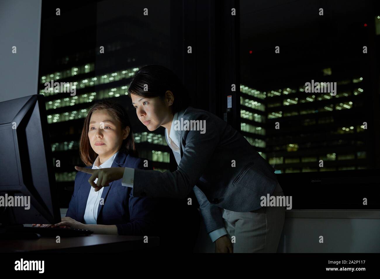 Japanese business people working late at night Stock Photo - Alamy
