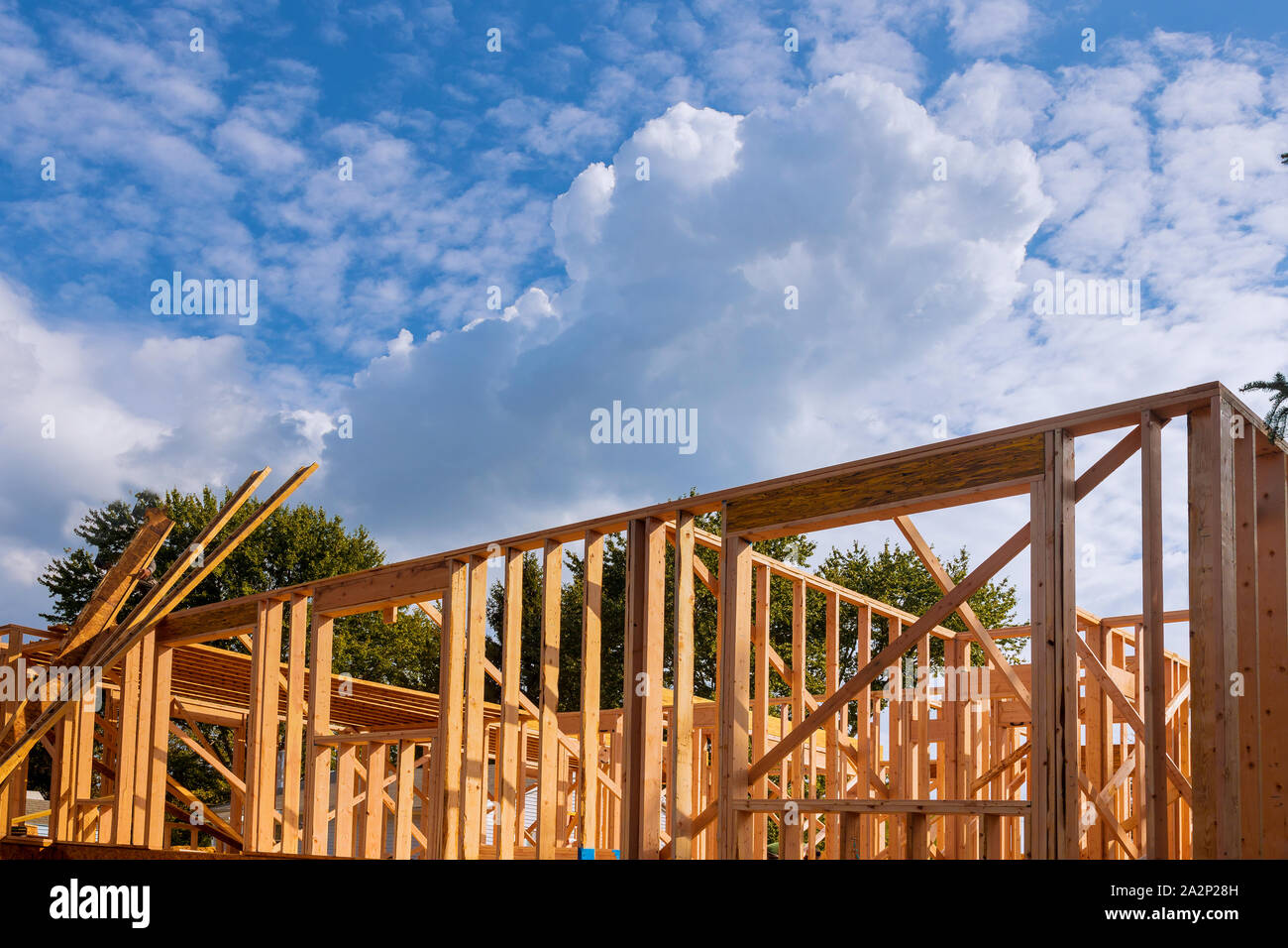 Home new wood frame stick built home under construction a blue sky ...
