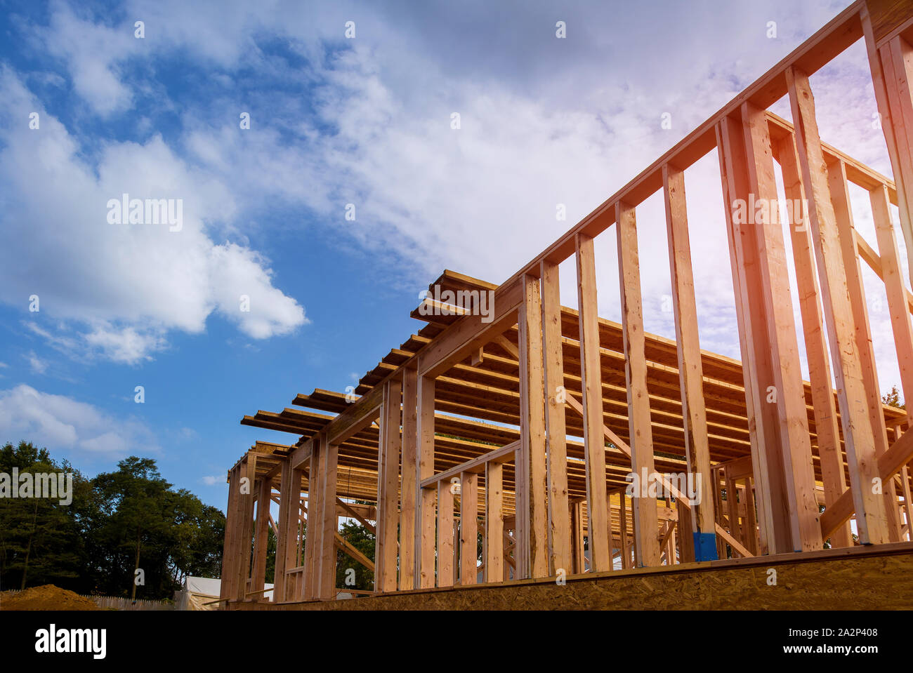 Exterior framing of a new house under construction frame stick abstract ...