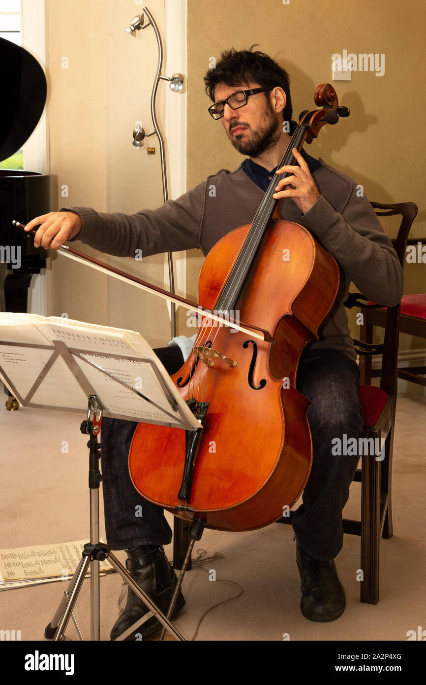 Playing cello hi-res stock photography and images - Alamy