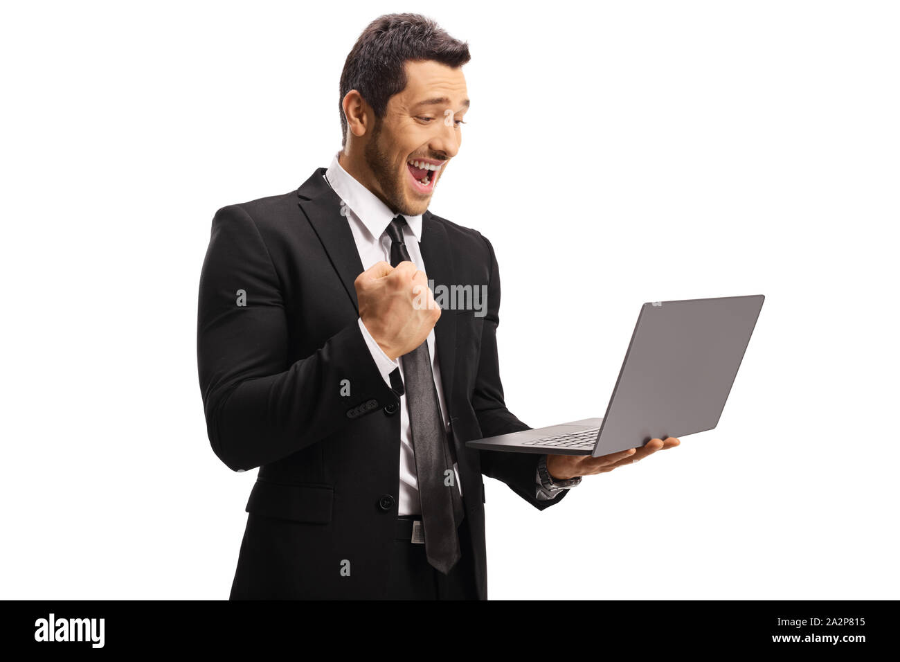Happy professional man gesturing and looking at a laptop computer ...