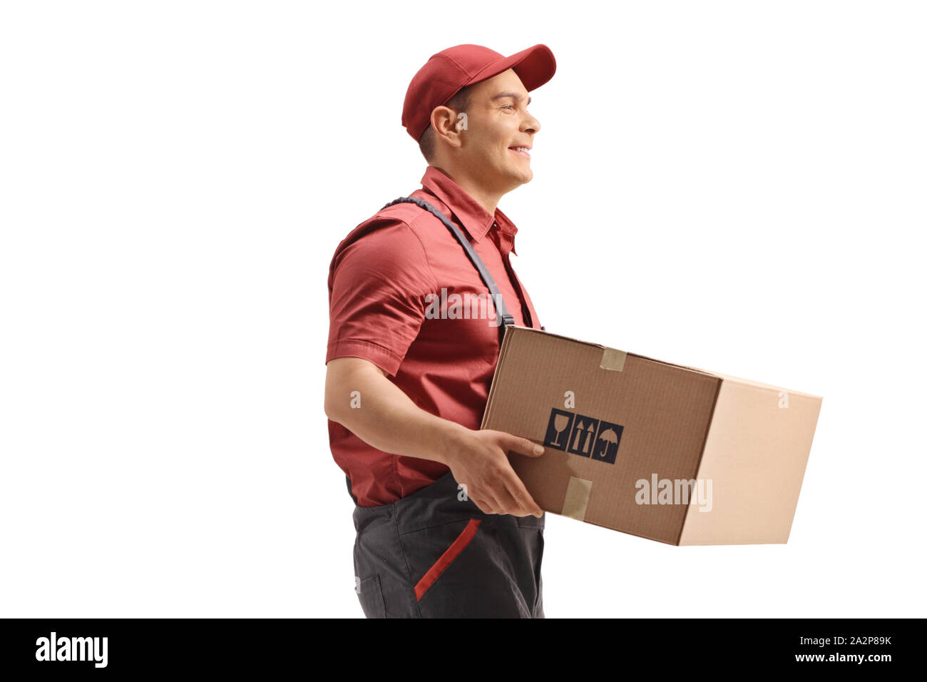 Worker carrying a package isolated on white background Stock Photo - Alamy