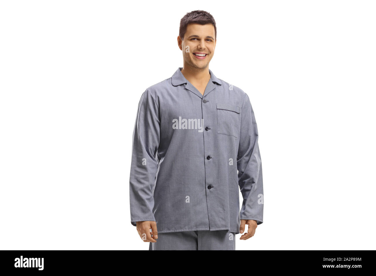 Guy in pajamas smiling isolated on white background Stock Photo - Alamy