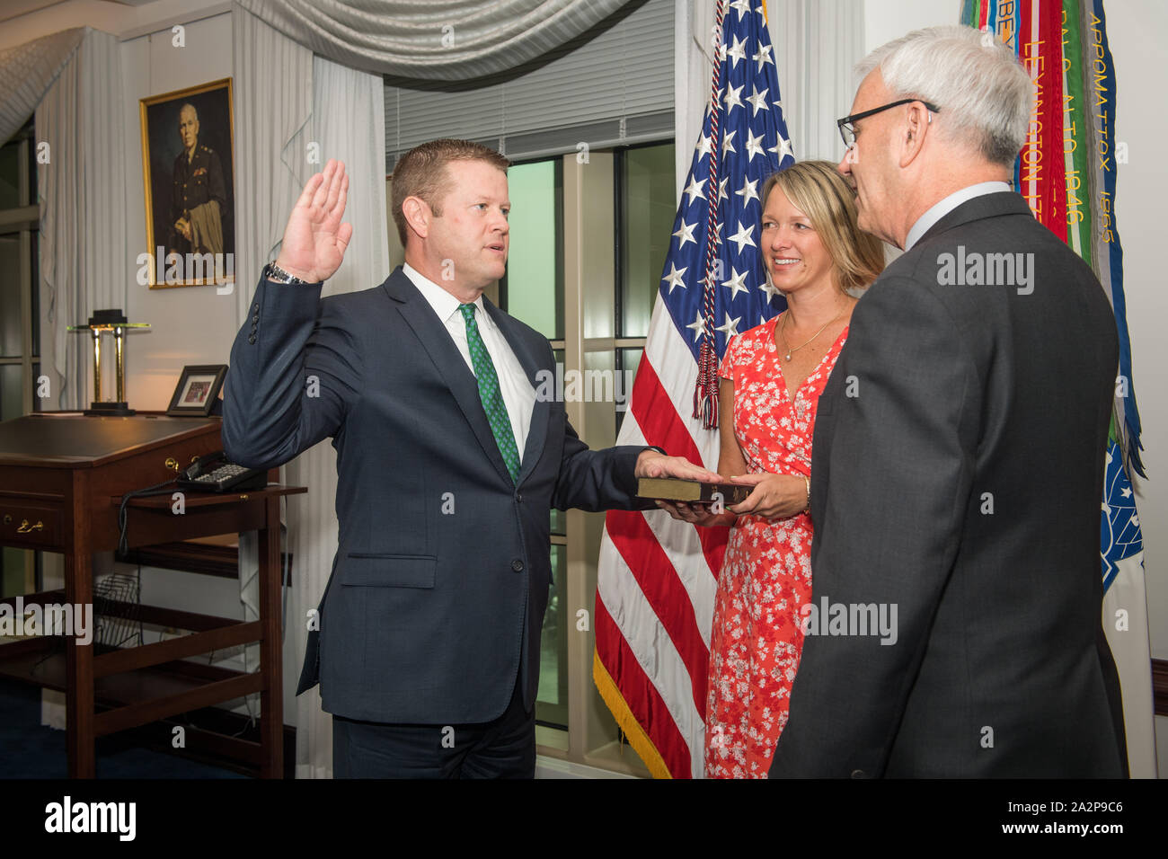 U.S. Under Secretary of the Army Ryan D. McCarthy, left, takes the oath ...