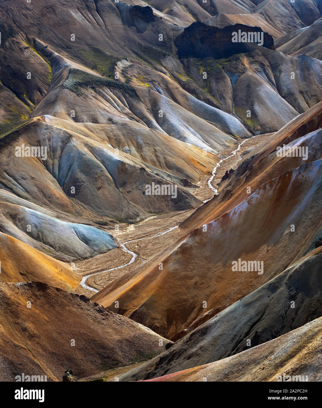 River along a Valley in Landmannalaugar among colorful mountains ...