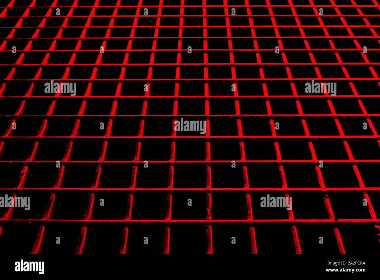 Slanted view over a red grid that an be used as background or wallpaper ...