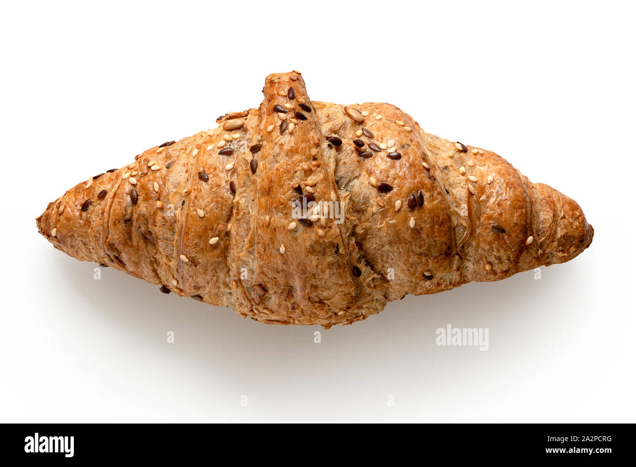 Whole wheat croissant with linseeds and sesame seeds isolated on white ...