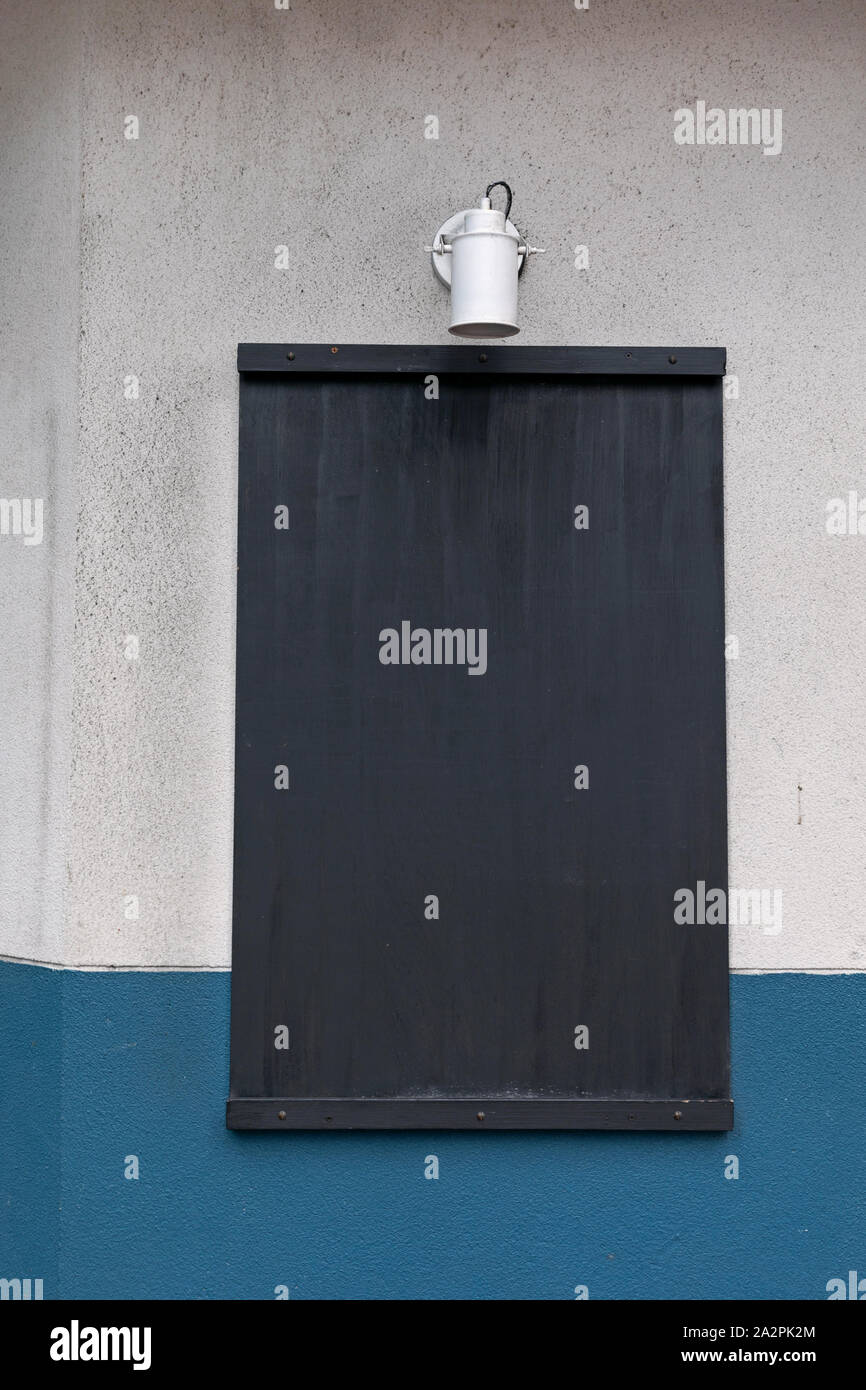Empty Black Board at Wall Info Stock Photo - Alamy
