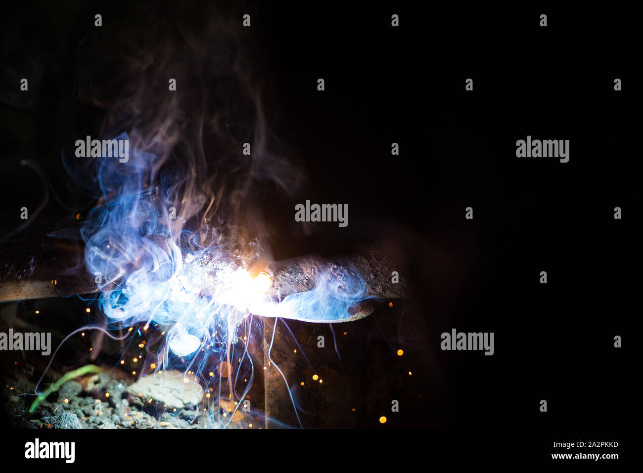 Pipe welding. Bright light when welding. Dross from metal and smoke ...