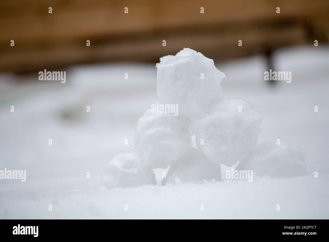 real snowballs with their hands clasped from the fresh snow in winter ...
